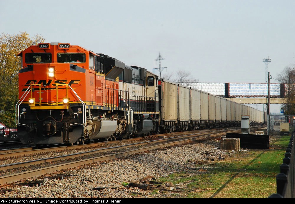 BNSF 9347 heads east with CEFX empties for PRB.